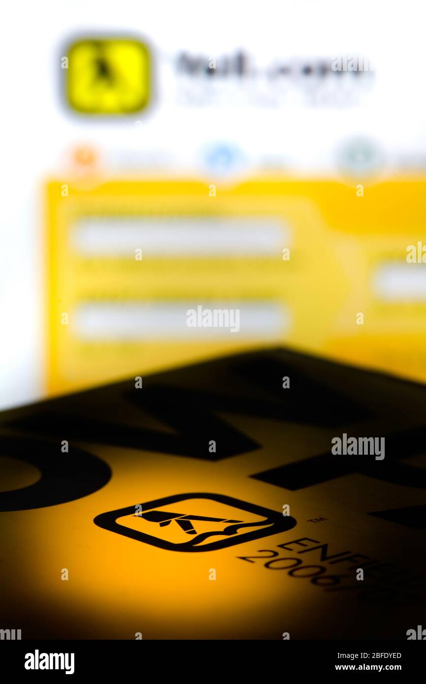 A Yellow Pages in front of a computer screen with Yellow Pages' online ...