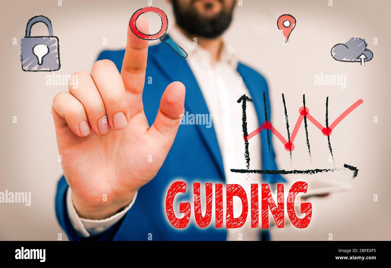 Text sign showing Guiding. Business photo showcasing to show someone ...