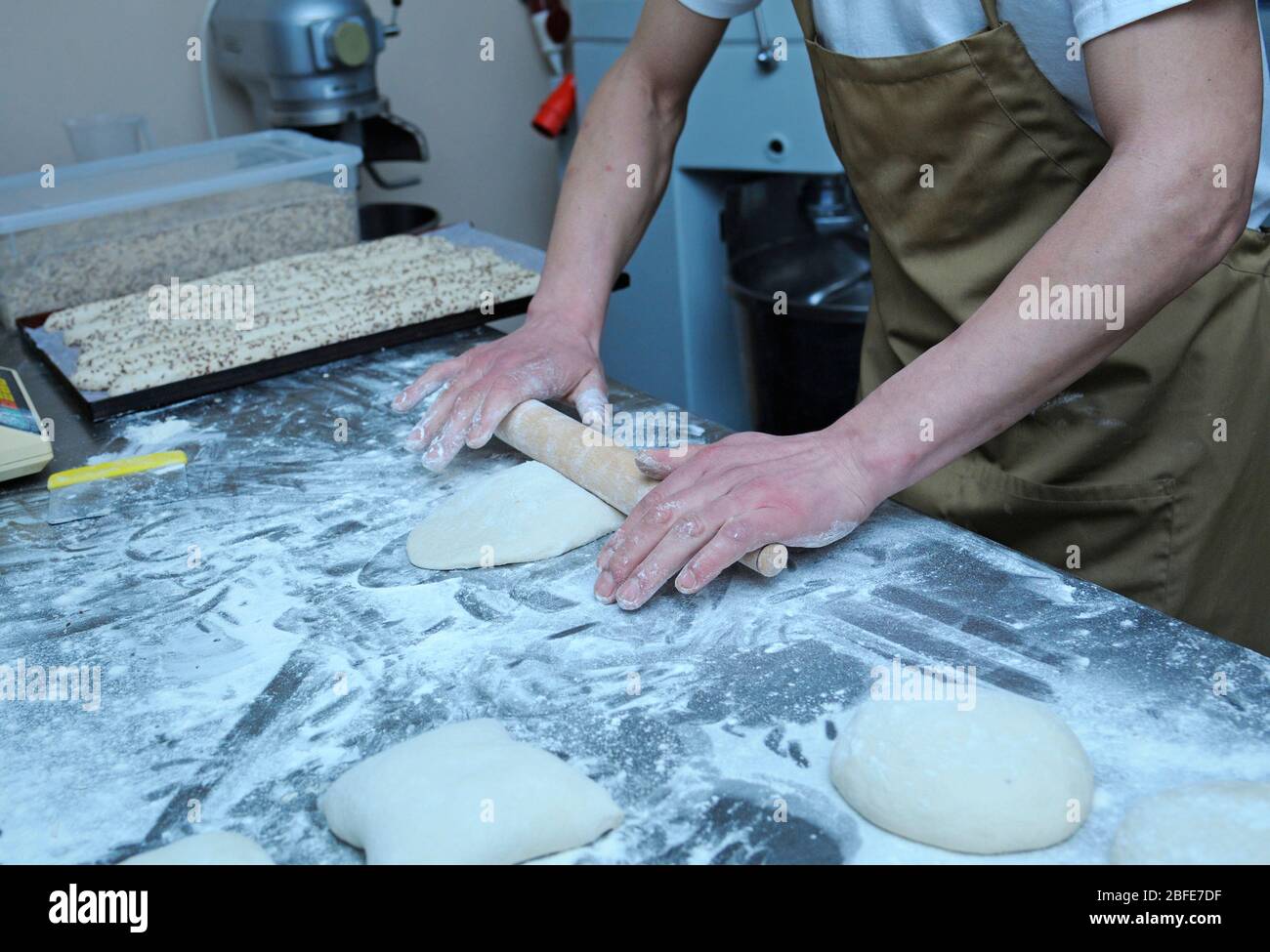 Man molding bread hi-res stock photography and images - Alamy