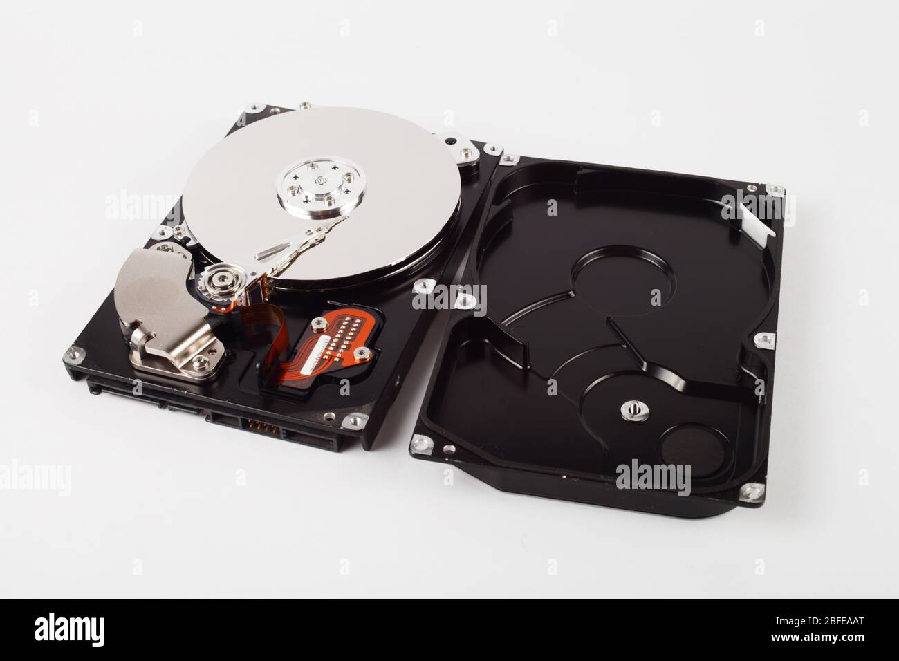 Disassembled hard drive on white background Stock Photo - Alamy