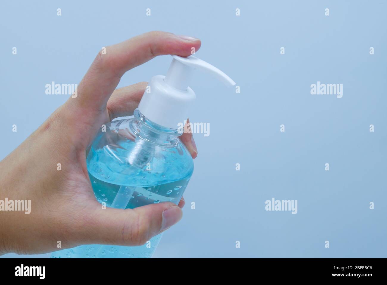 men's hand is holding cleaning gel that prepare to protect health from ...