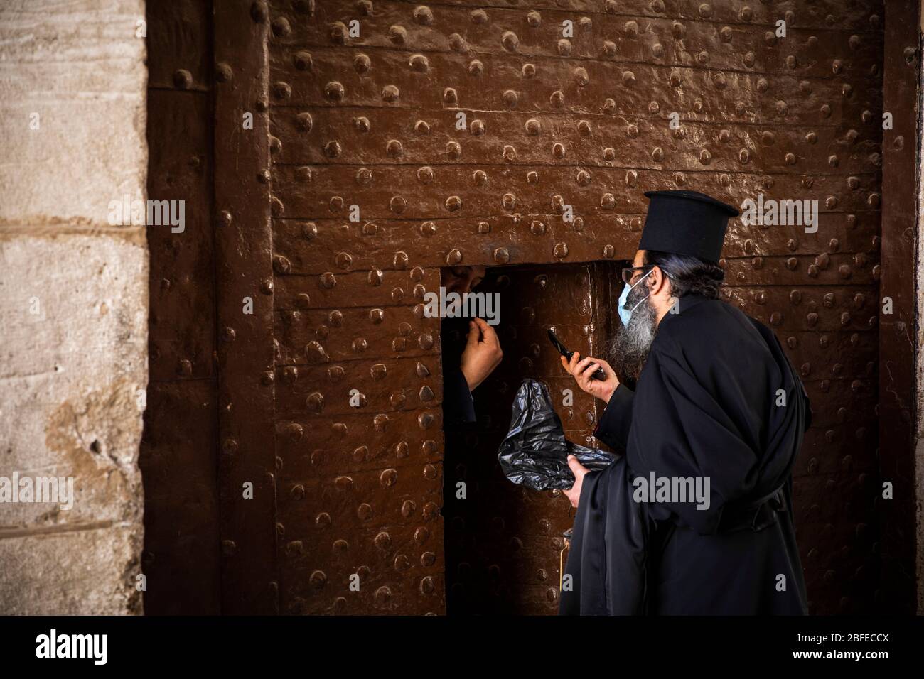 Jerusalem, Israel. 18th Apr, 2020. A Greek Orthodox priest wearing a ...