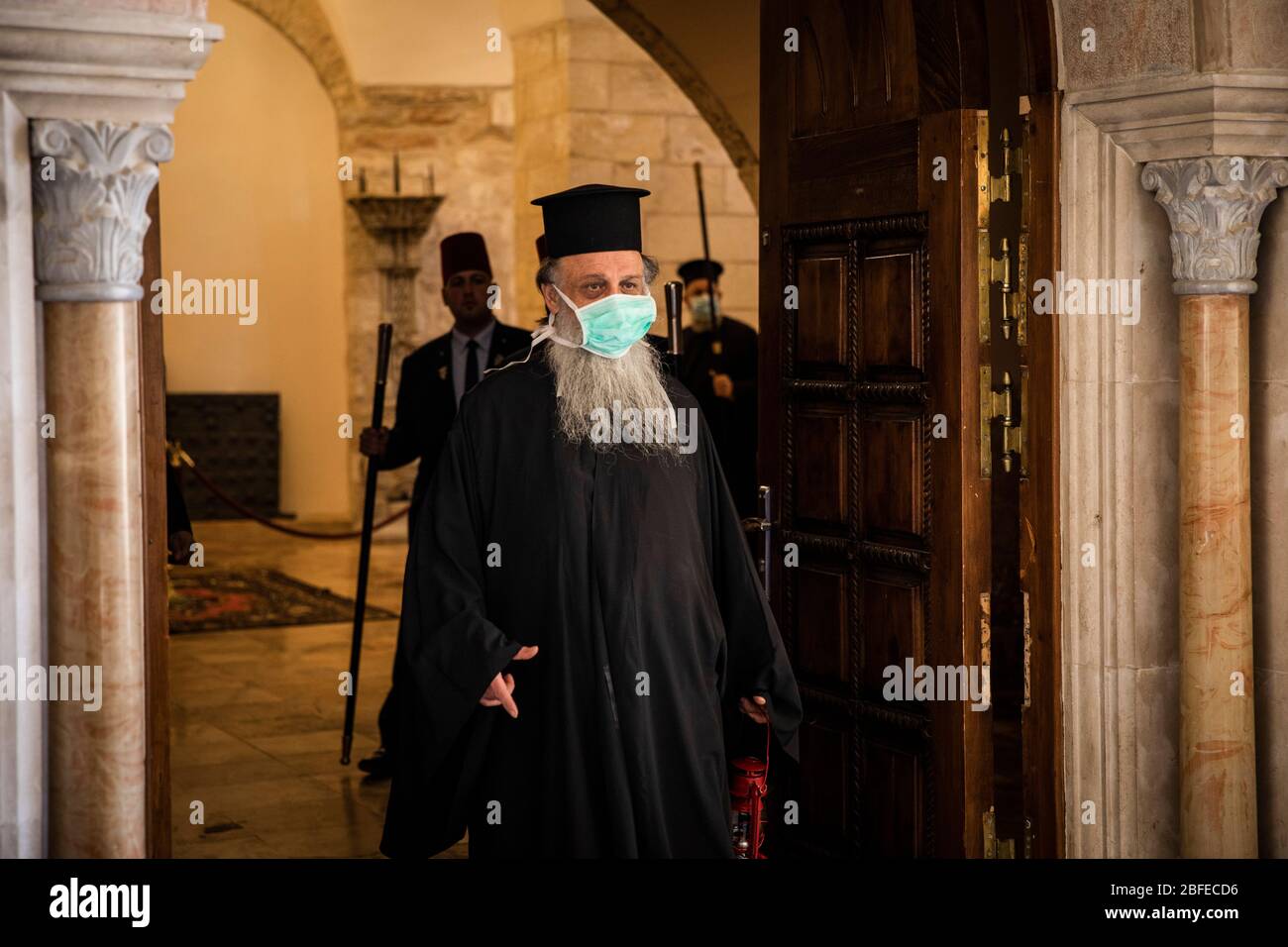 Jerusalem, Israel. 18th Apr, 2020. A Greek Orthodox priest wearing a ...