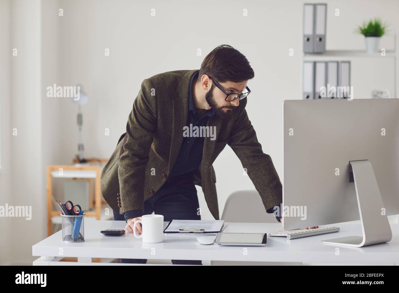 Office, formal, man behind computer hi-res stock photography and images ...
