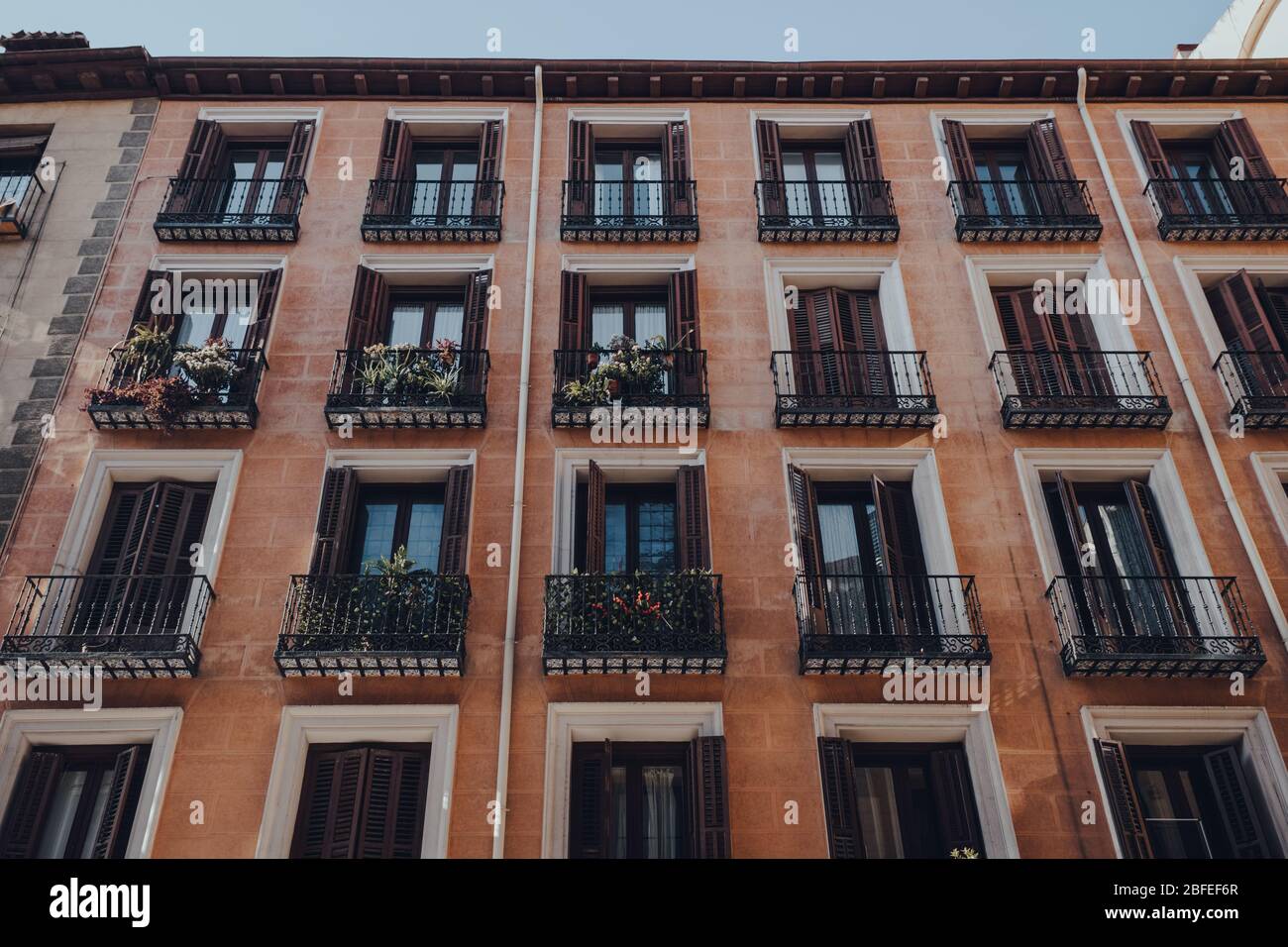 Facade of a traditional apartment block building in Old Town, Madrid ...
