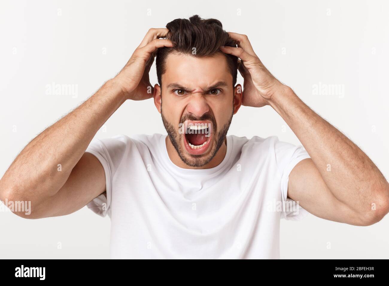 Serious bossy or businessman with looking at camera. Isolated on white ...