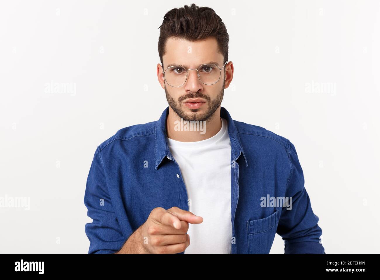 Serious bossy or businessman with looking at camera. Isolated on white ...