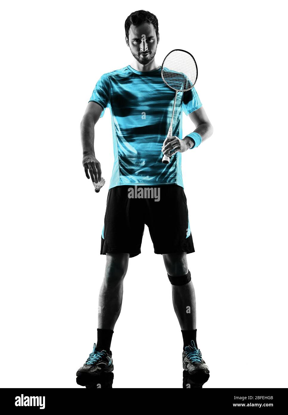 one caucasian Badminton player man in studio shadow silhouette isolated ...