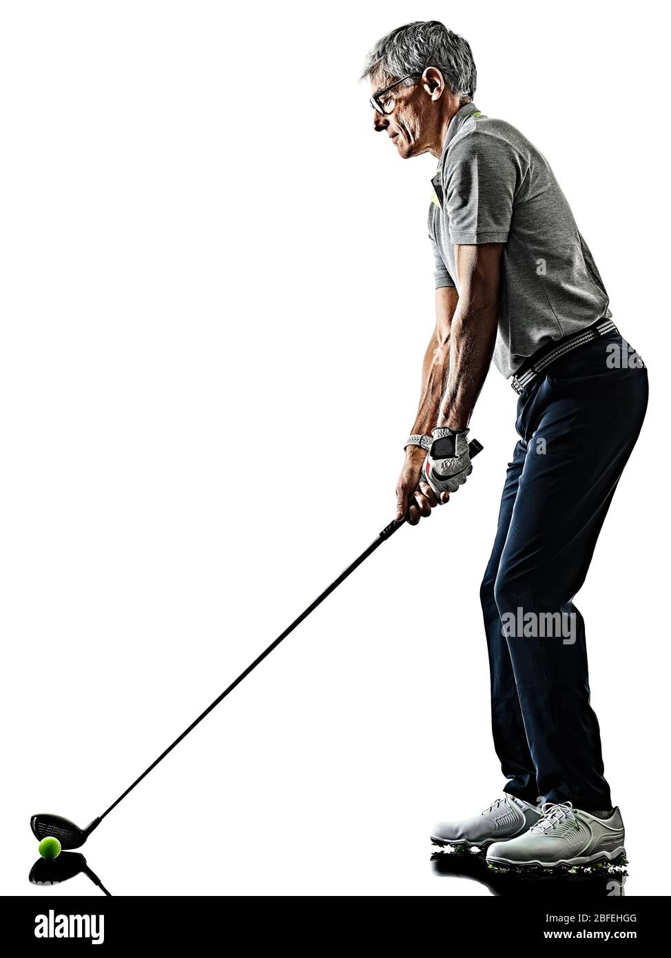 one caucasian senior man golfer golfing in studio shadow silhouette ...