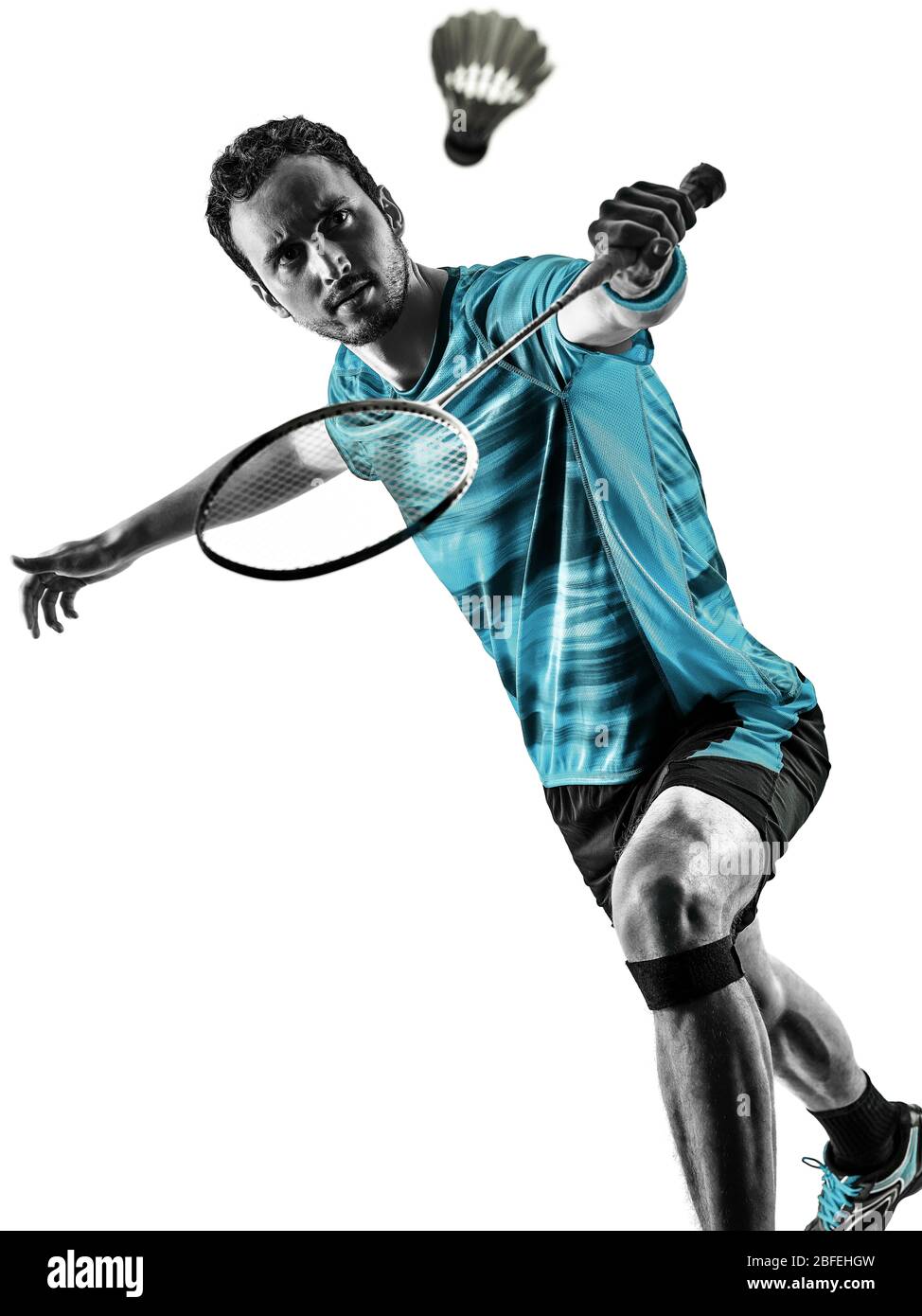 one caucasian Badminton player man in studio shadow silhouette isolated ...
