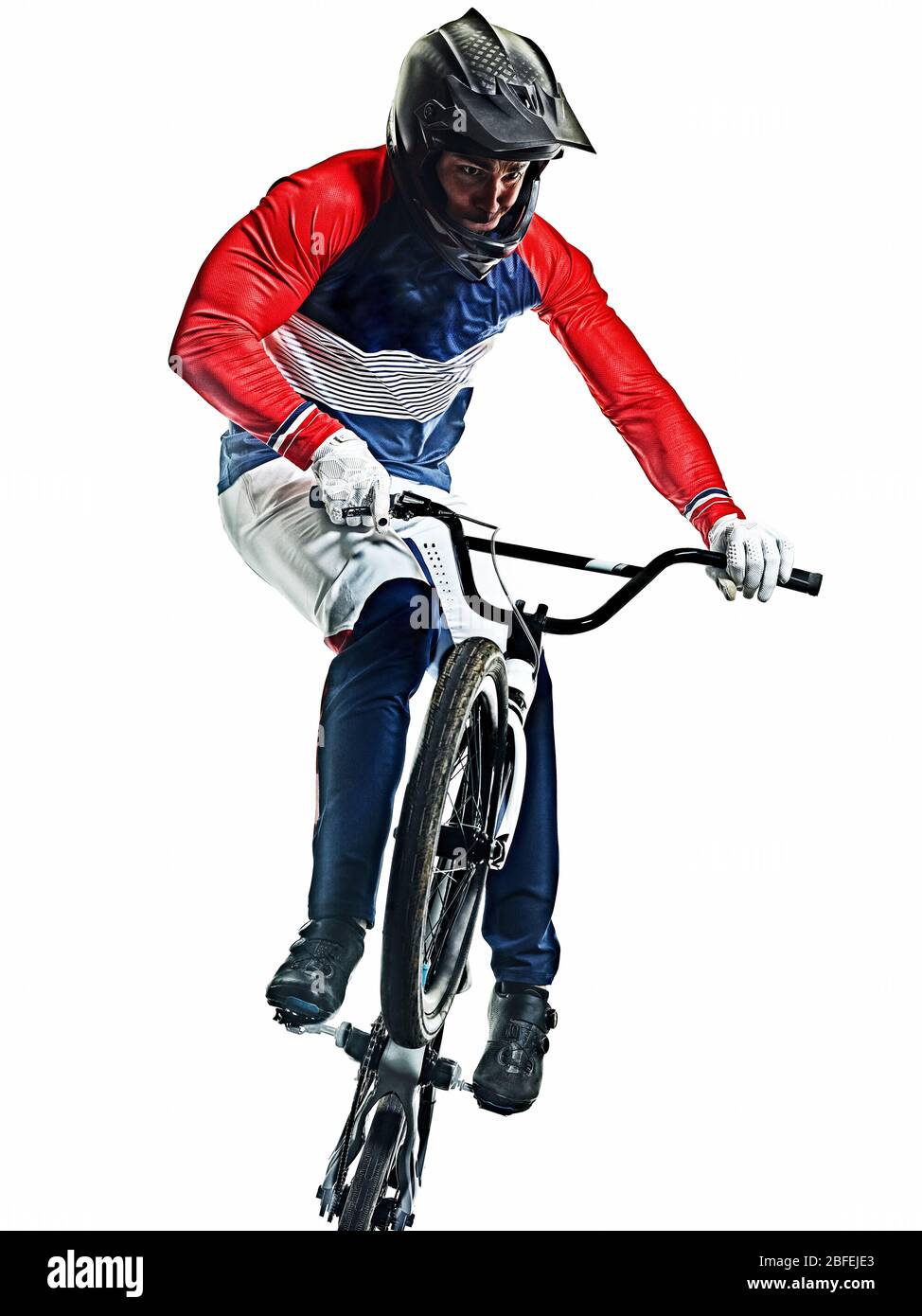 one caucasian BMX racer jumping in studio silhouette isolated on white ...