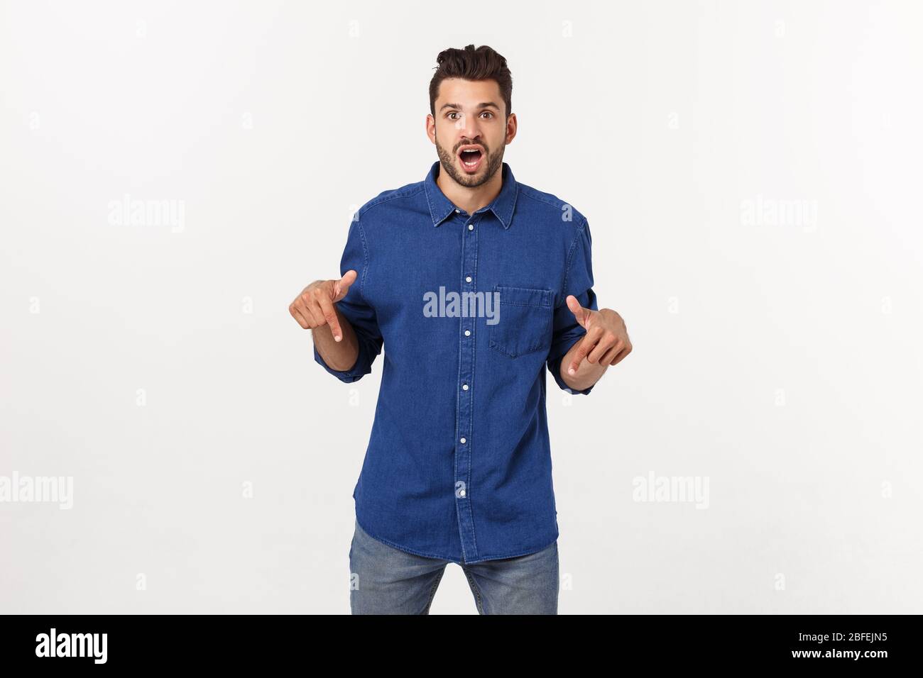 Man pointing showing copy space isolated on white background. Casual ...