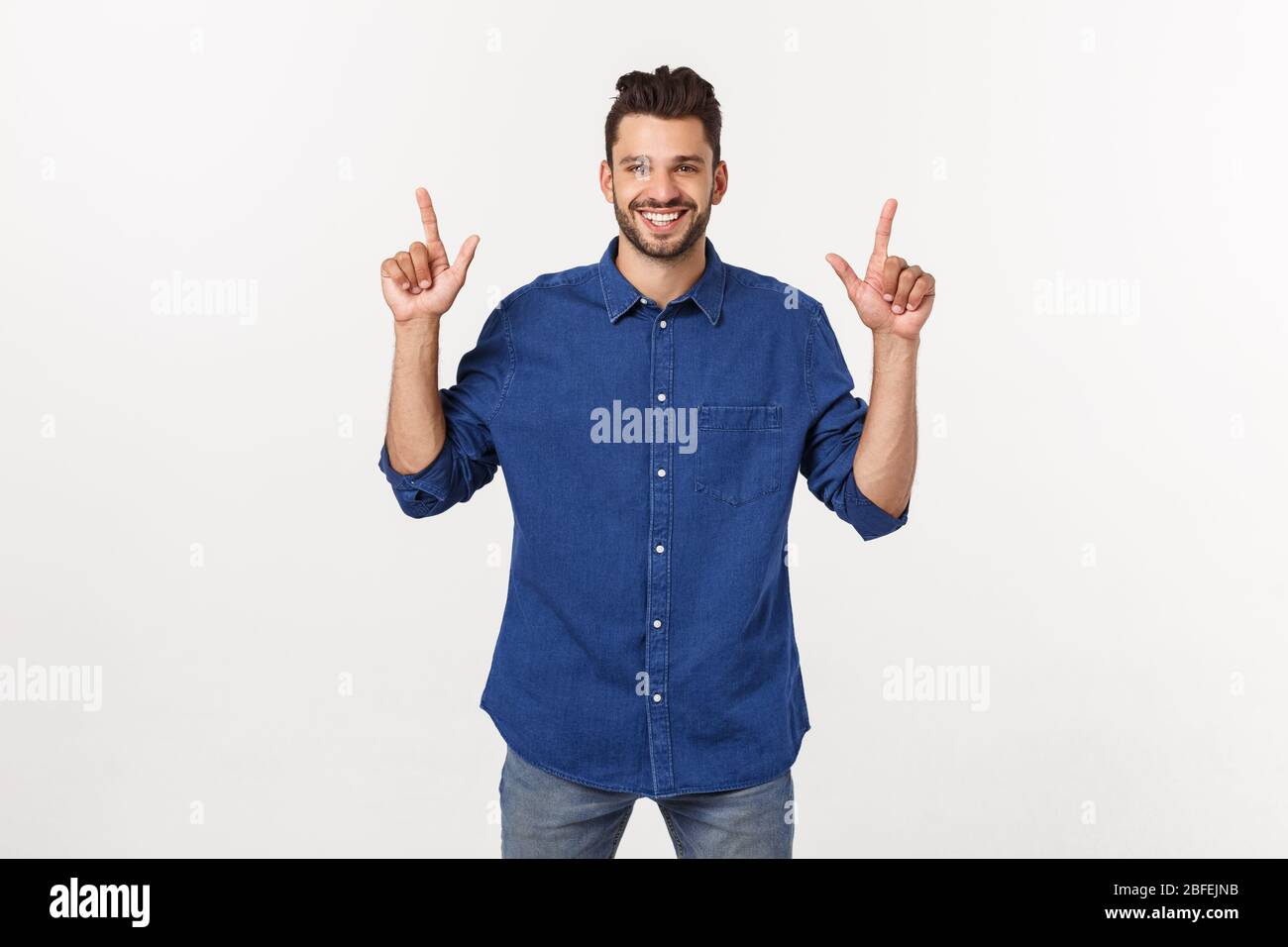 Man pointing showing copy space isolated on white background. Casual ...