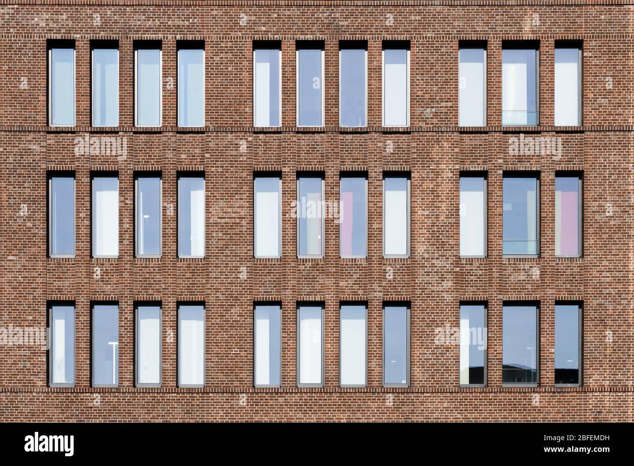 Dutch clinker brick facade in different brown and red tones with high ...