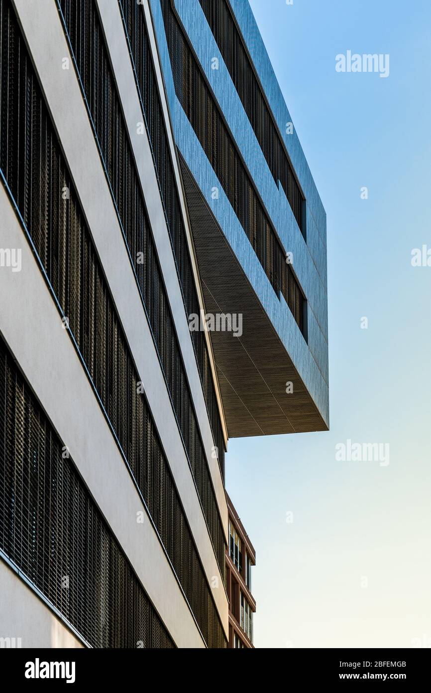 Modern facade front of modern business office building in front of blue ...