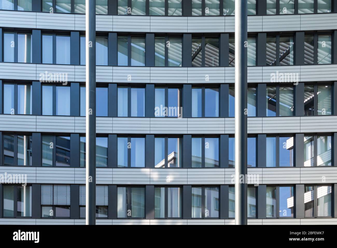 Modern facade of office buildings with stainless steel elements and big ...