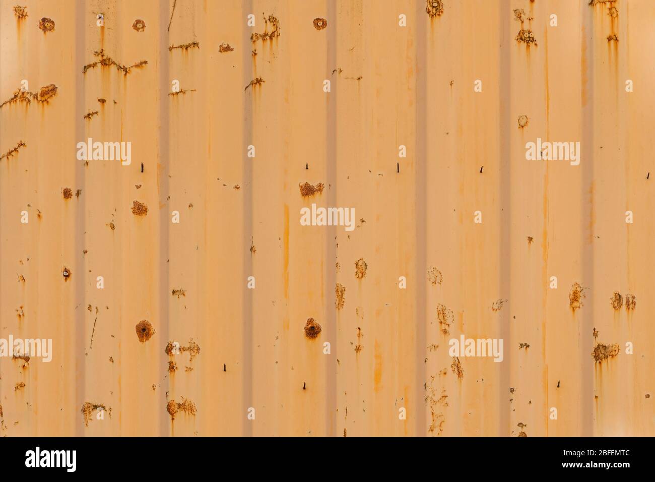 Texture of old an rusty ship container yellow paint starting to fall ...