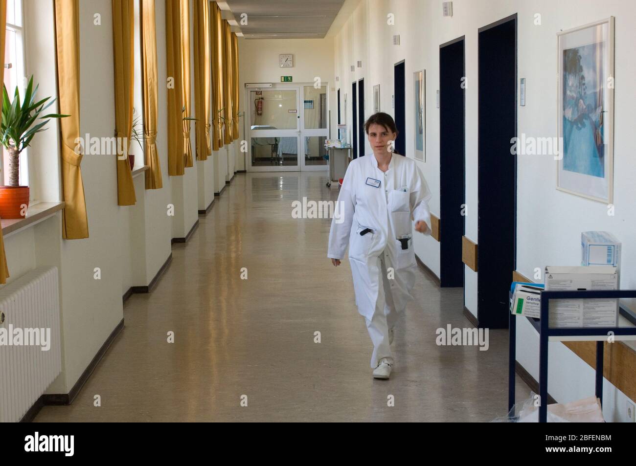 Doctor walking on hospital hi-res stock photography and images - Alamy