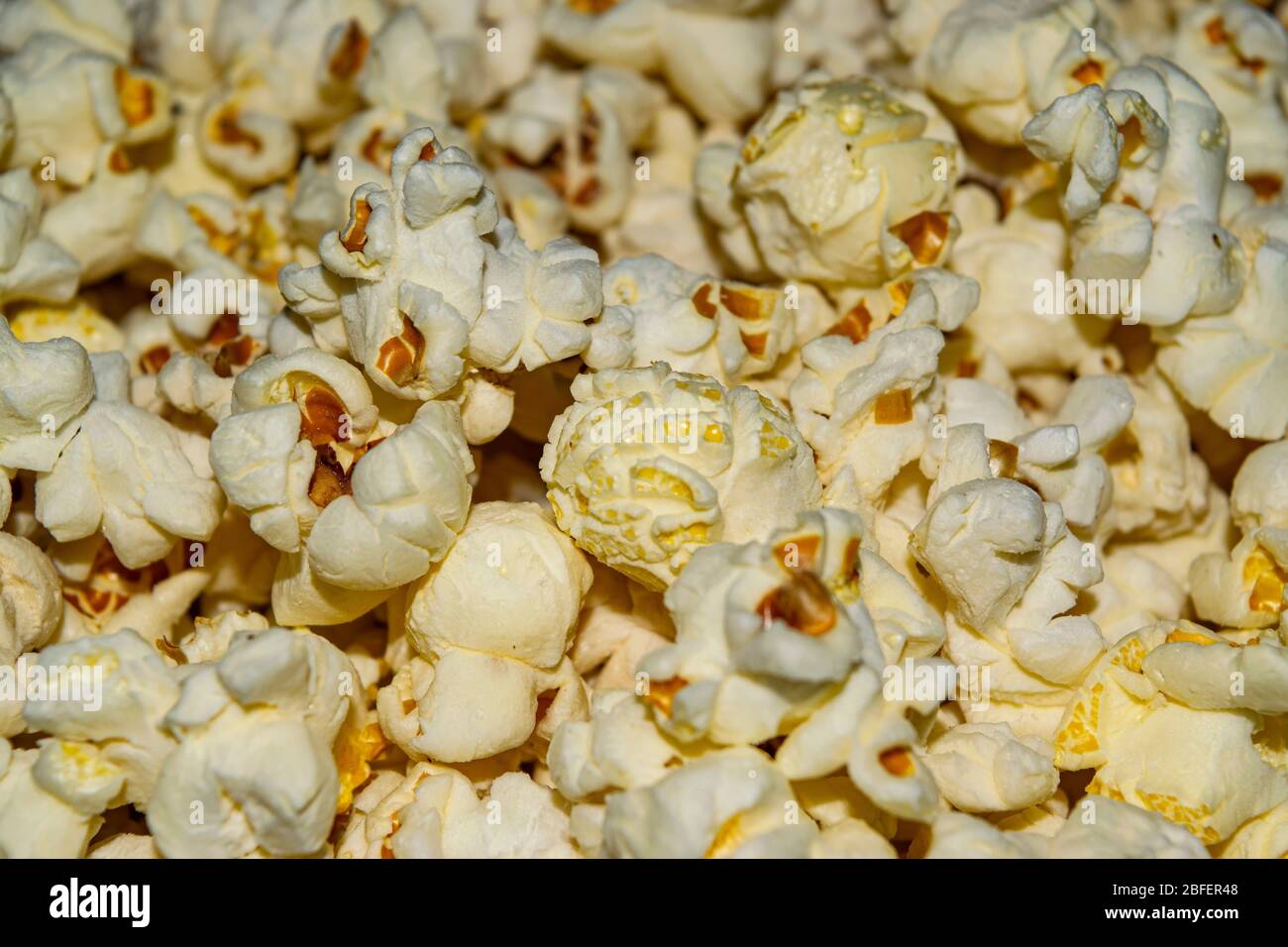Popcorn surface texture background image. Close up Stock Photo - Alamy