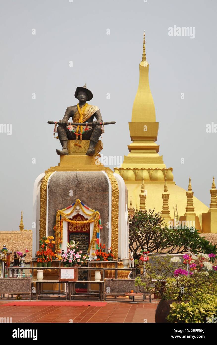 King Sethathirath statue and Pha That Luang temple in Vientiane. Laos ...