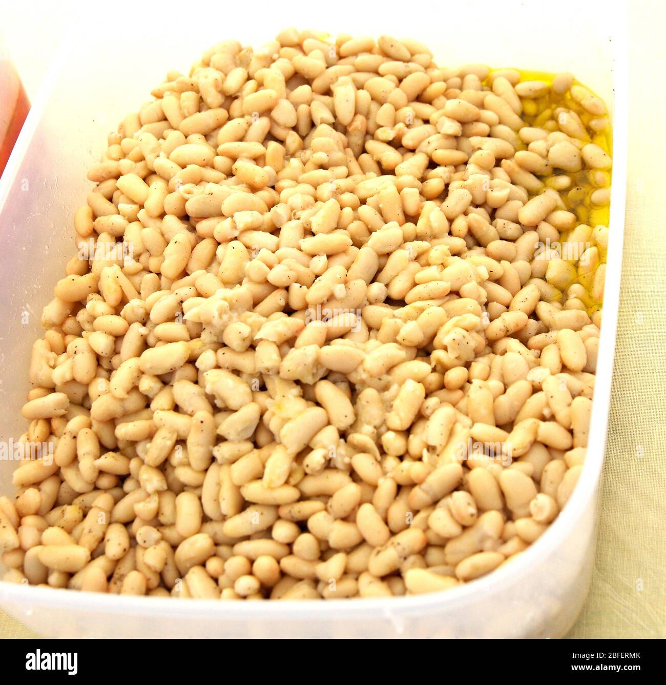 healthy cheap food, large tray of beans flavored with oil, salt and ...