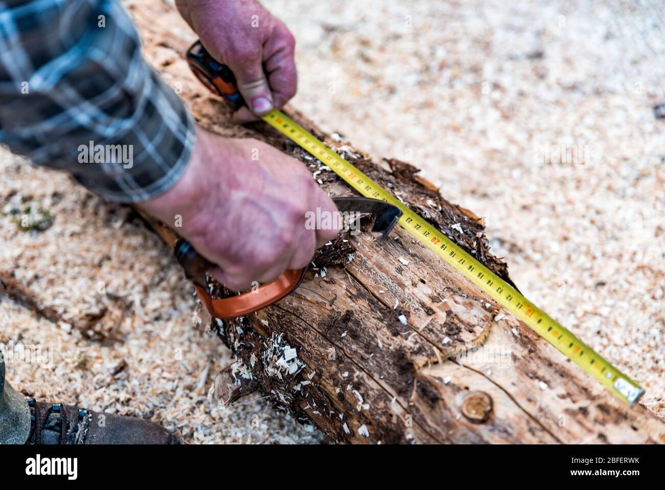Old rusty timber scriber or woodworking marking gauge and wood log on ...