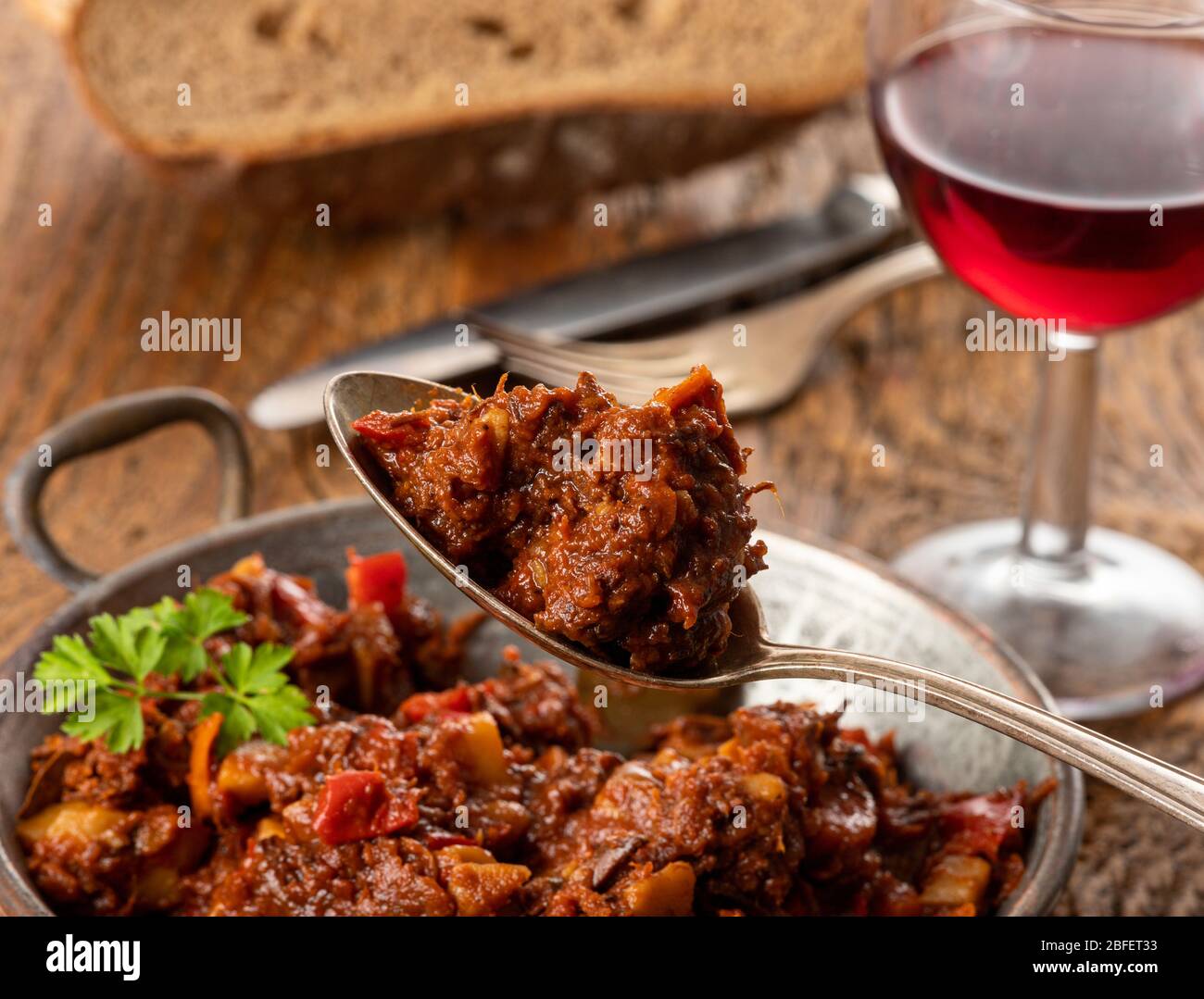 portion of austrian goulash on wood Stock Photo - Alamy