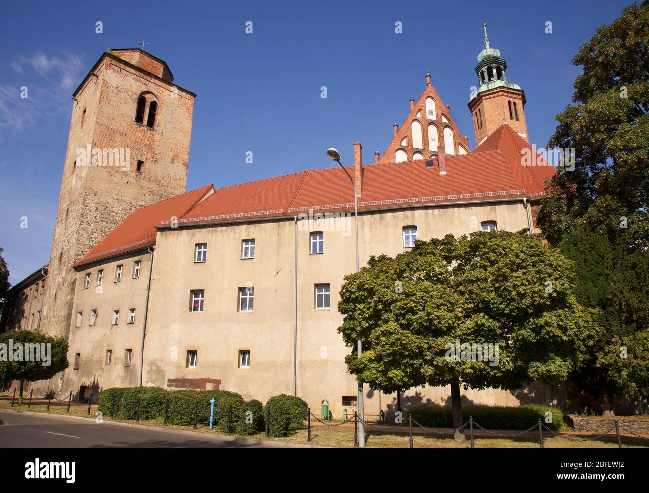 Old bell tower and church of Holiest Heart of Jesus in Zary. Poland ...