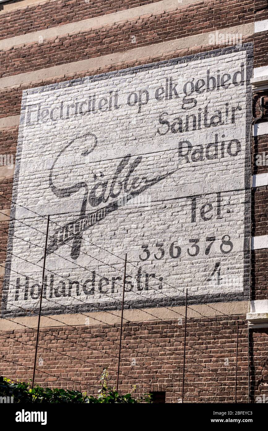 An old Dutch advertisement on a brick building Stock Photo - Alamy