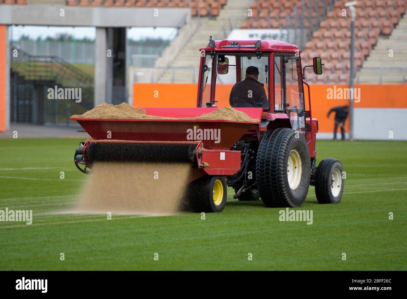 Sandblasting of football field Stock Photo - Alamy