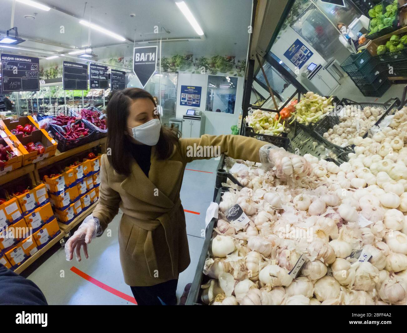Lviv, Ukraine - March 10, 2020: young women in mask at grocery store ...