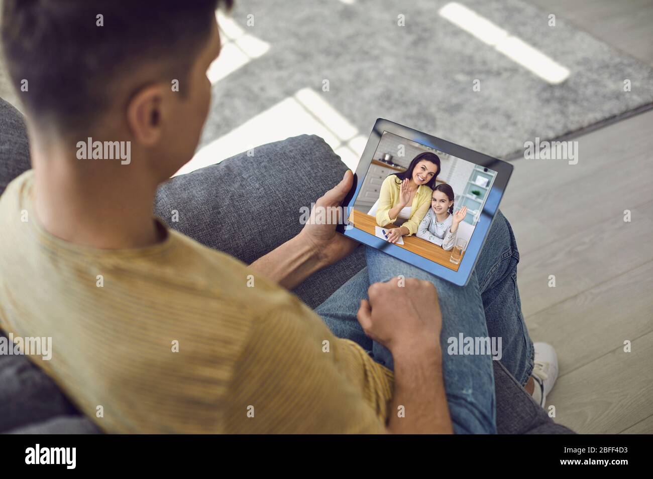 Family communicates online video call. Father talks with wife and ...