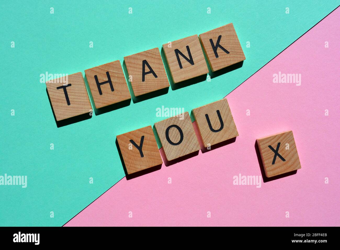 Thank You in 3d wood alphabet letters, and an X, symbol for a kiss ...