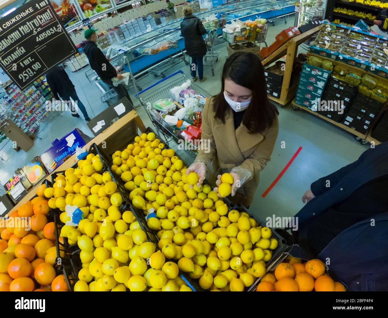 Lviv, Ukraine - March 10, 2020: young women in mask at grocery store ...