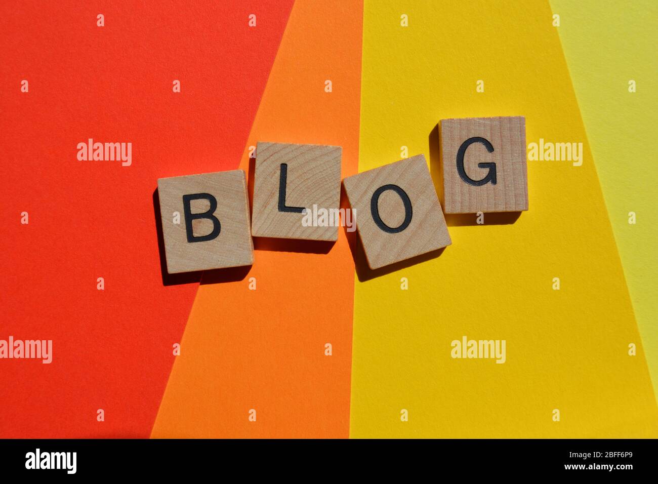 Blog, word in 3d wooden alphabet letters on brightly coloured ...