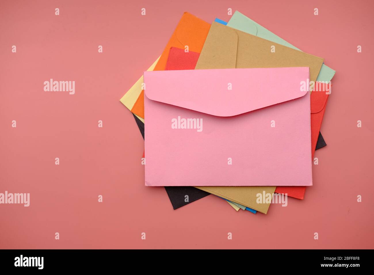 high angle view of colorful envelope pink background Stock Photo - Alamy