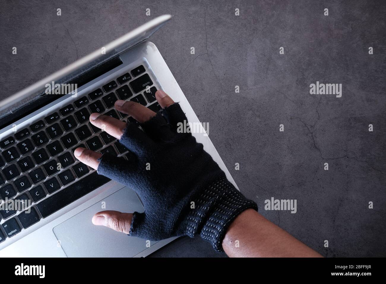 hacker hand stealing data from laptop, high angel view Stock Photo - Alamy