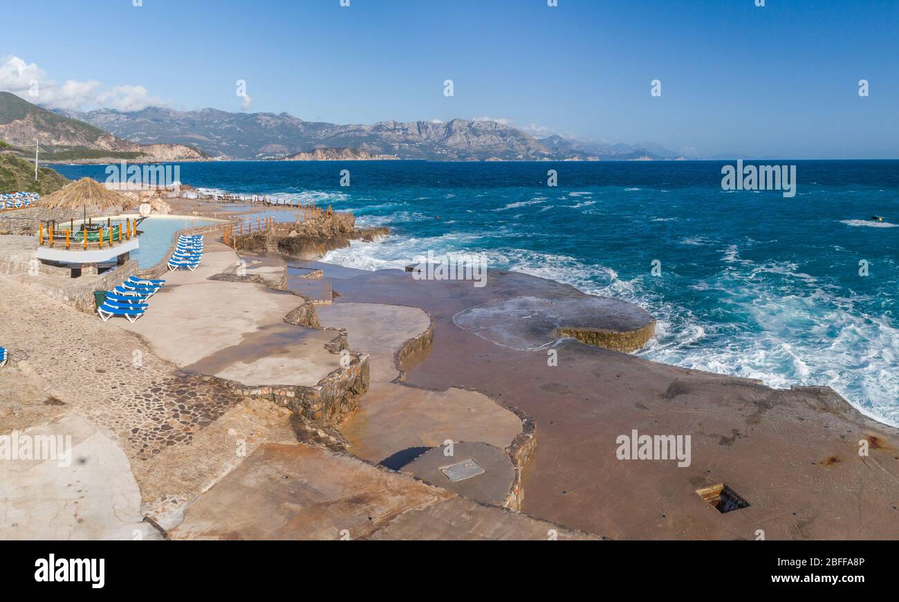 Panoramic aerial view of Ploce beach and storm waves on the Montenegrin ...