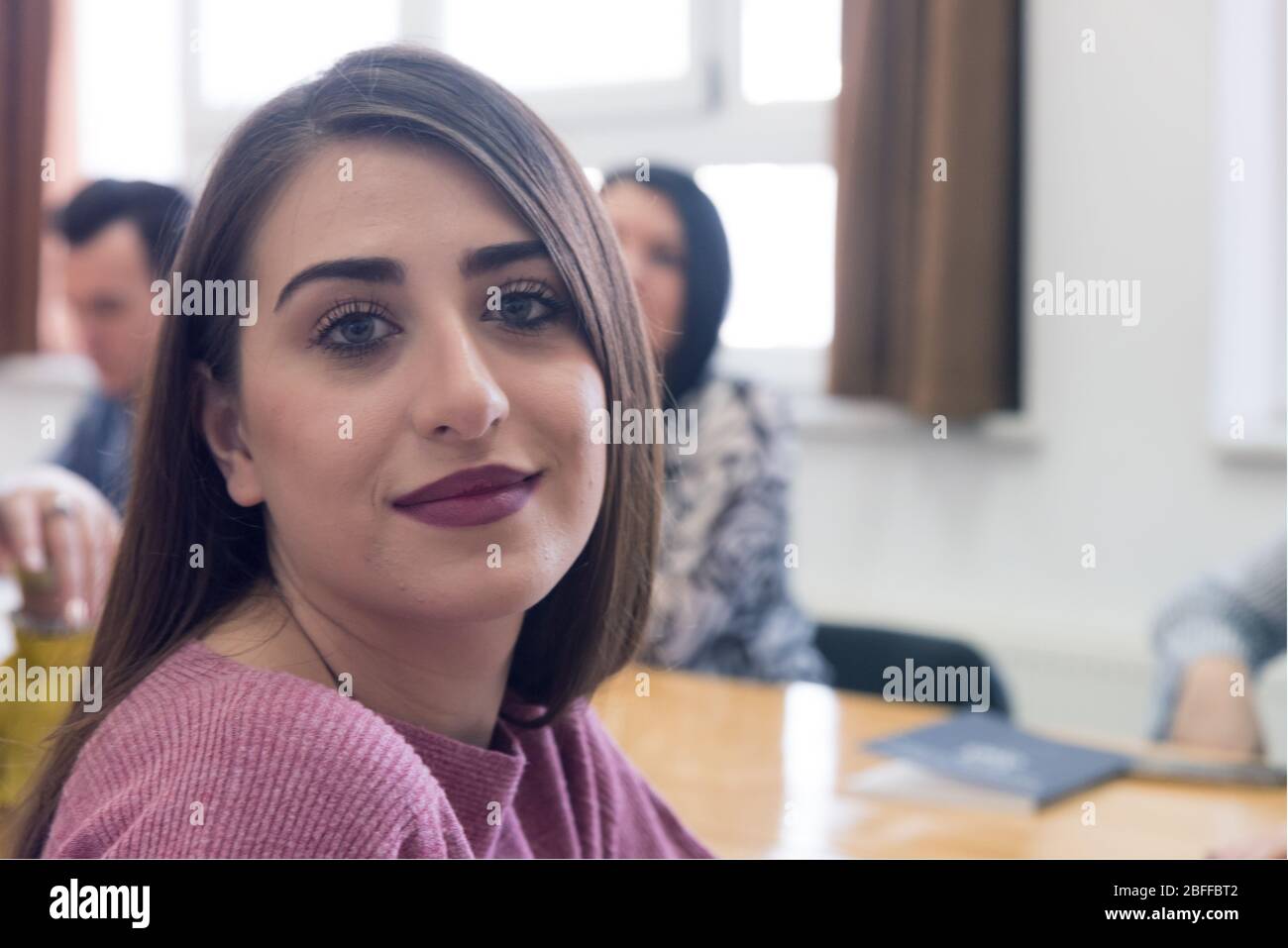 Side view of students using computer in lab. IT student looking and ...