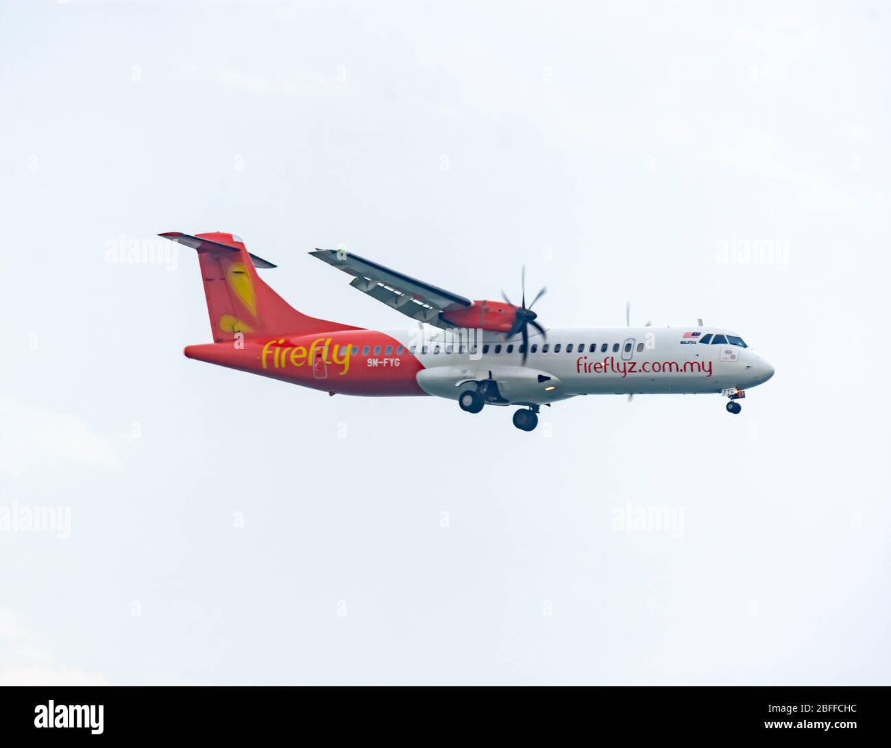 FIREFLY AIRLINE airplane during landing at Changi International Airport ...