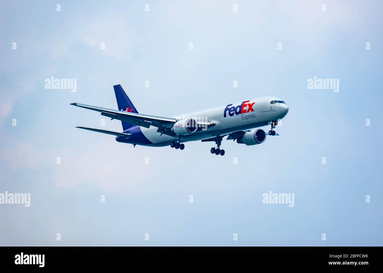 FEDERAL EXPRESS FEDEX airplane during landing at Changi International ...