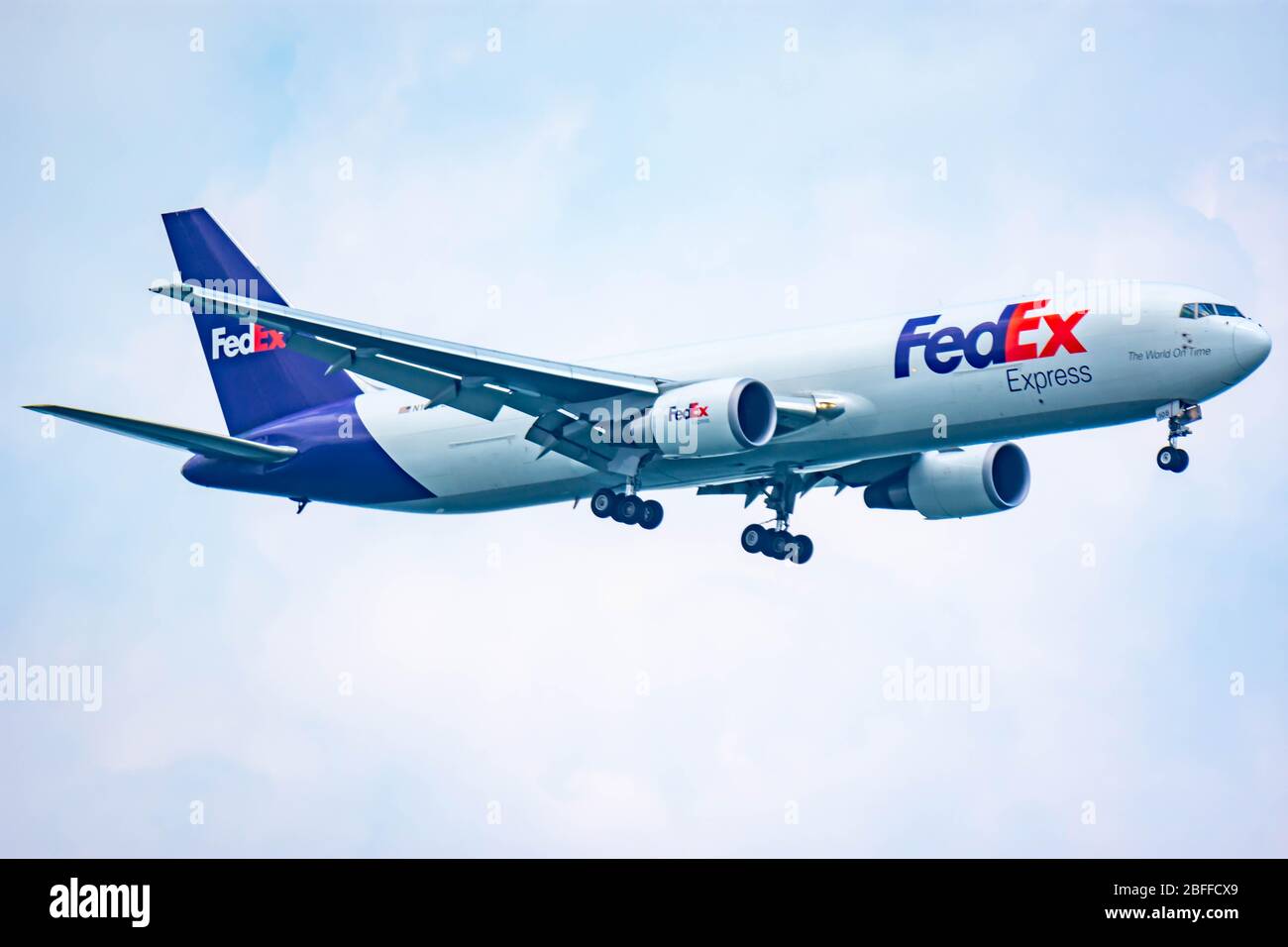 FEDERAL EXPRESS FEDEX airplane during landing at Changi International ...