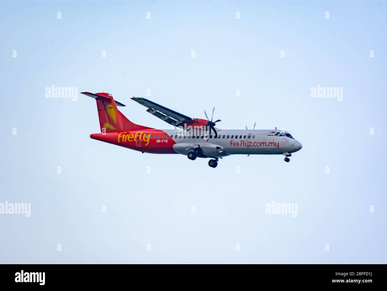 FIREFLY AIRLINE airplane during landing at Changi International Airport ...