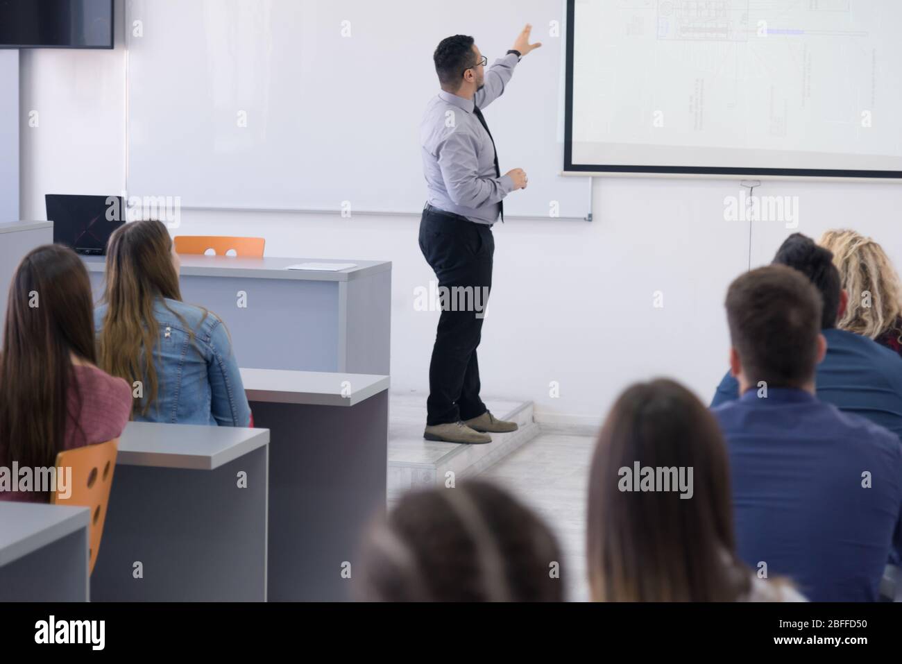 Male Professor Holding Lecture to Multi Ethnic Group of Students. Smart ...