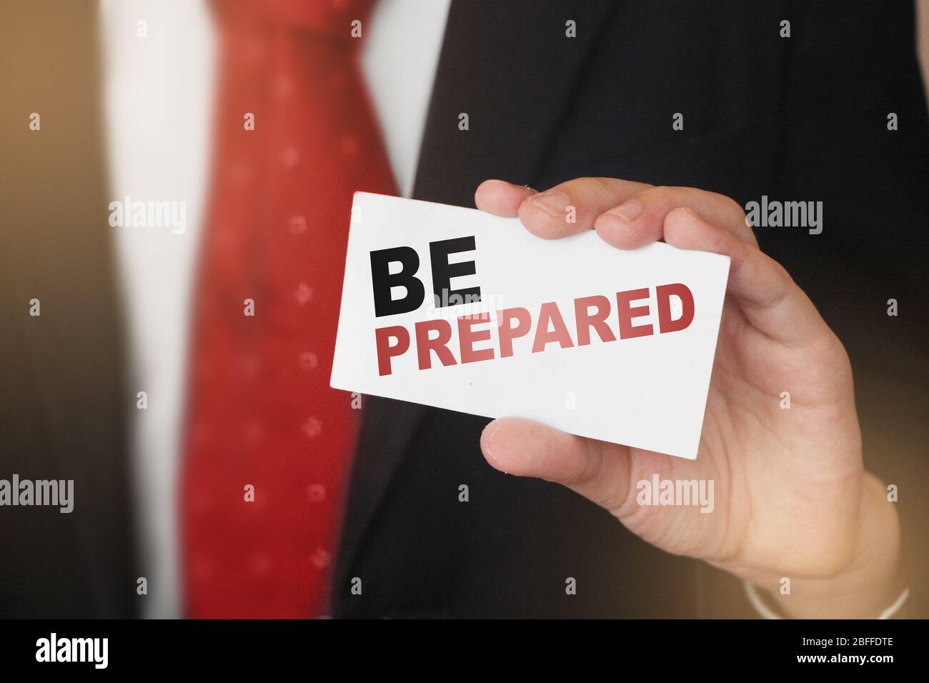 BE PREPARED, message on business card shown by a businessman. Business ...