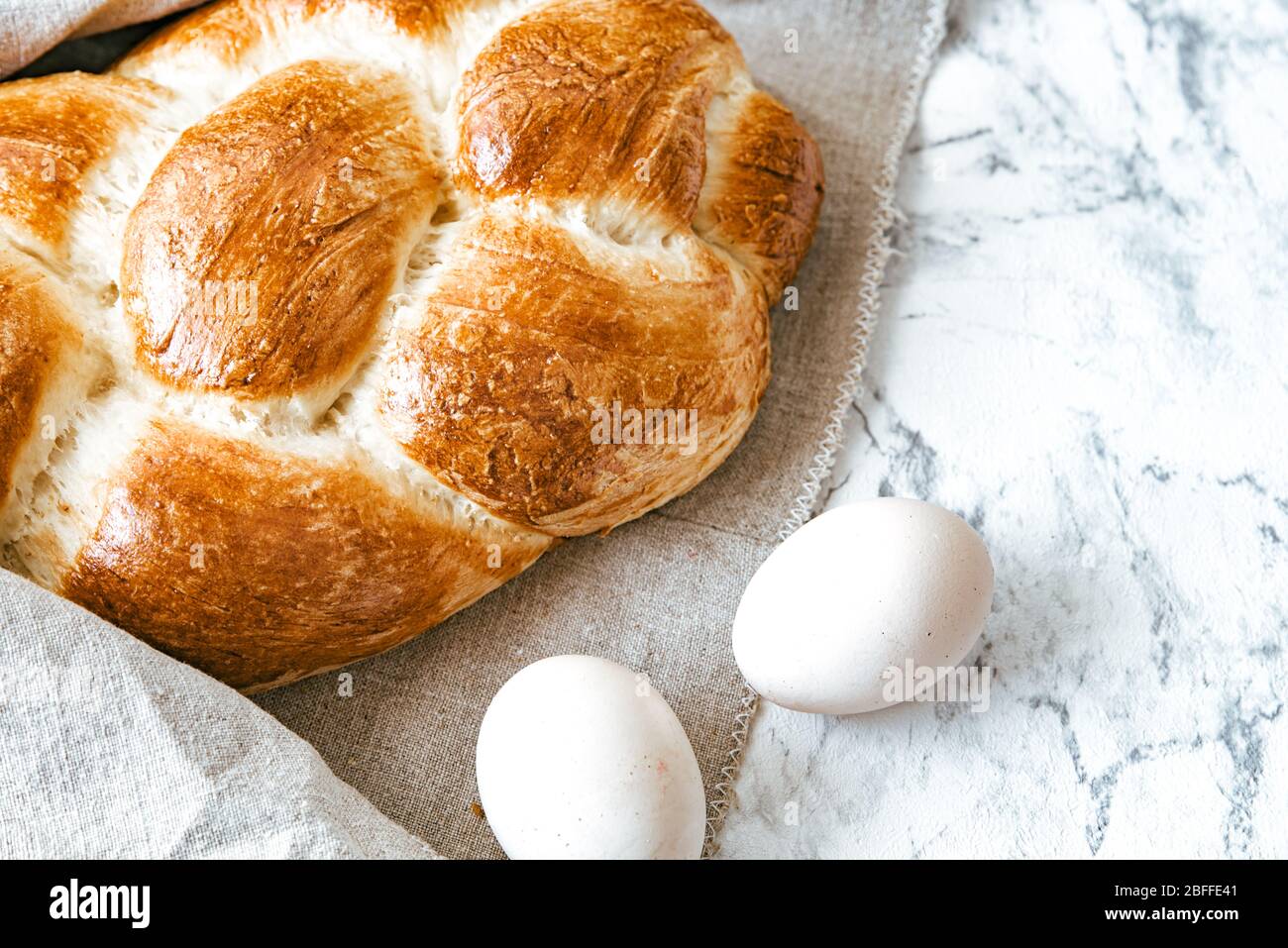 Homemade Jewish traditional challah bread on marble table, flat lay ...