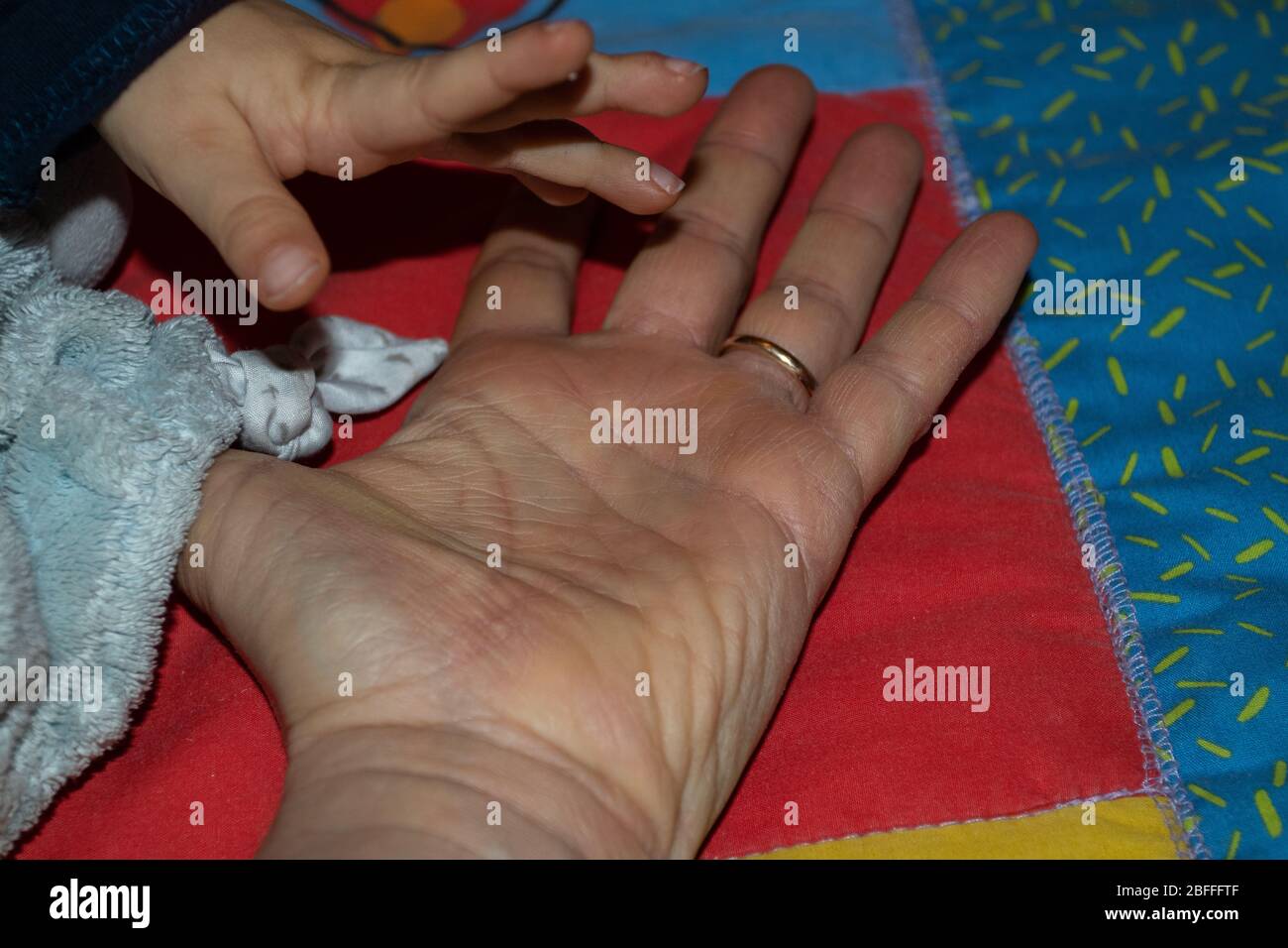 Baby hand holding finger ring hi-res stock photography and images - Alamy
