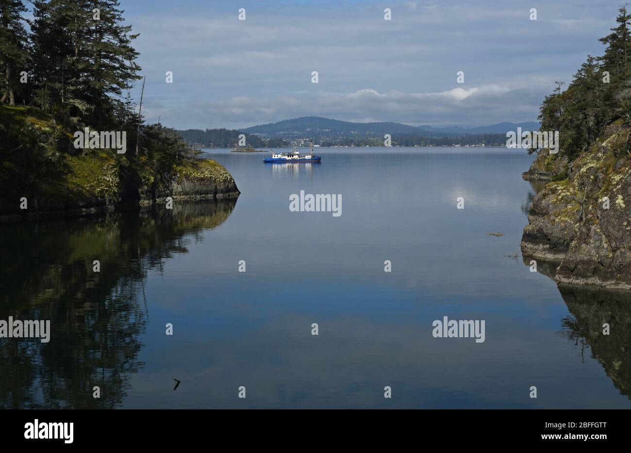 A view from the entrance to Roche Cove to the waters of the Sooke Basin ...