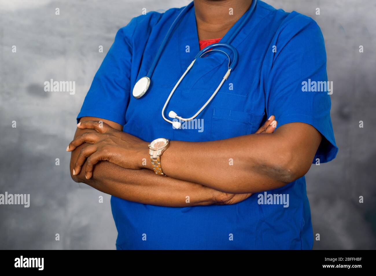 Female doctor's hands standing with hands crossed on chest with ...