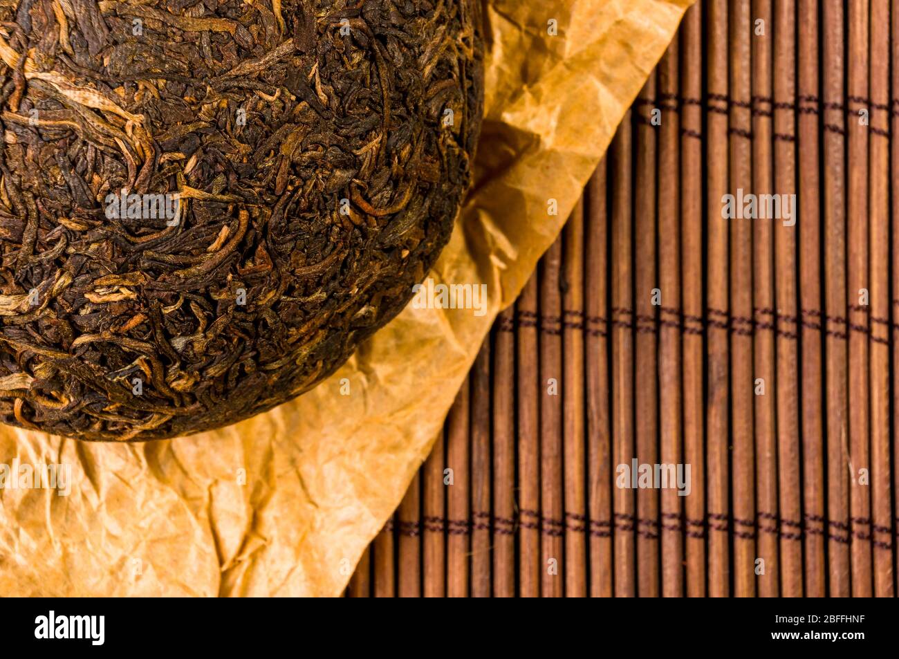 Chinese pressed PU-erh tea on wrapping paper, close-up, macro Stock ...